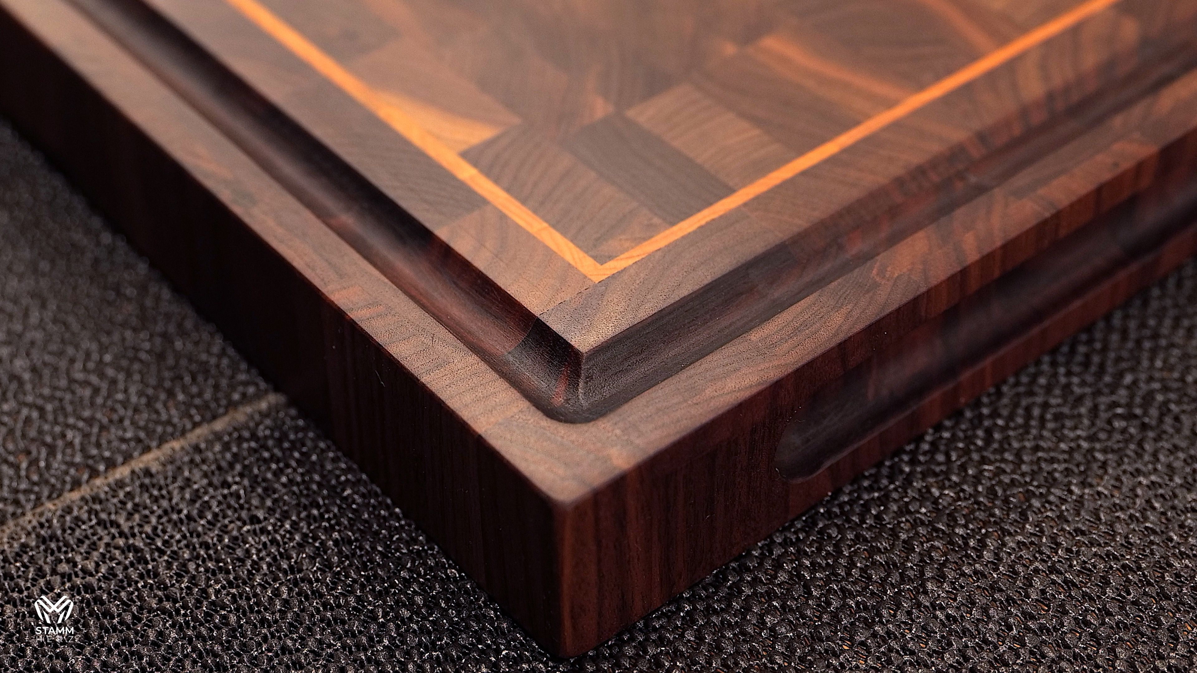 Noble end grain walnut cutting board with bright inlay